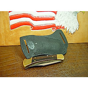 Buck Custom Left Hand Cross Draw Knife Sheath for a 110 Knife. The Sheath is Made Out of Buffalo Hide Leather Hand Tooled with a Basket Weave Pattern.