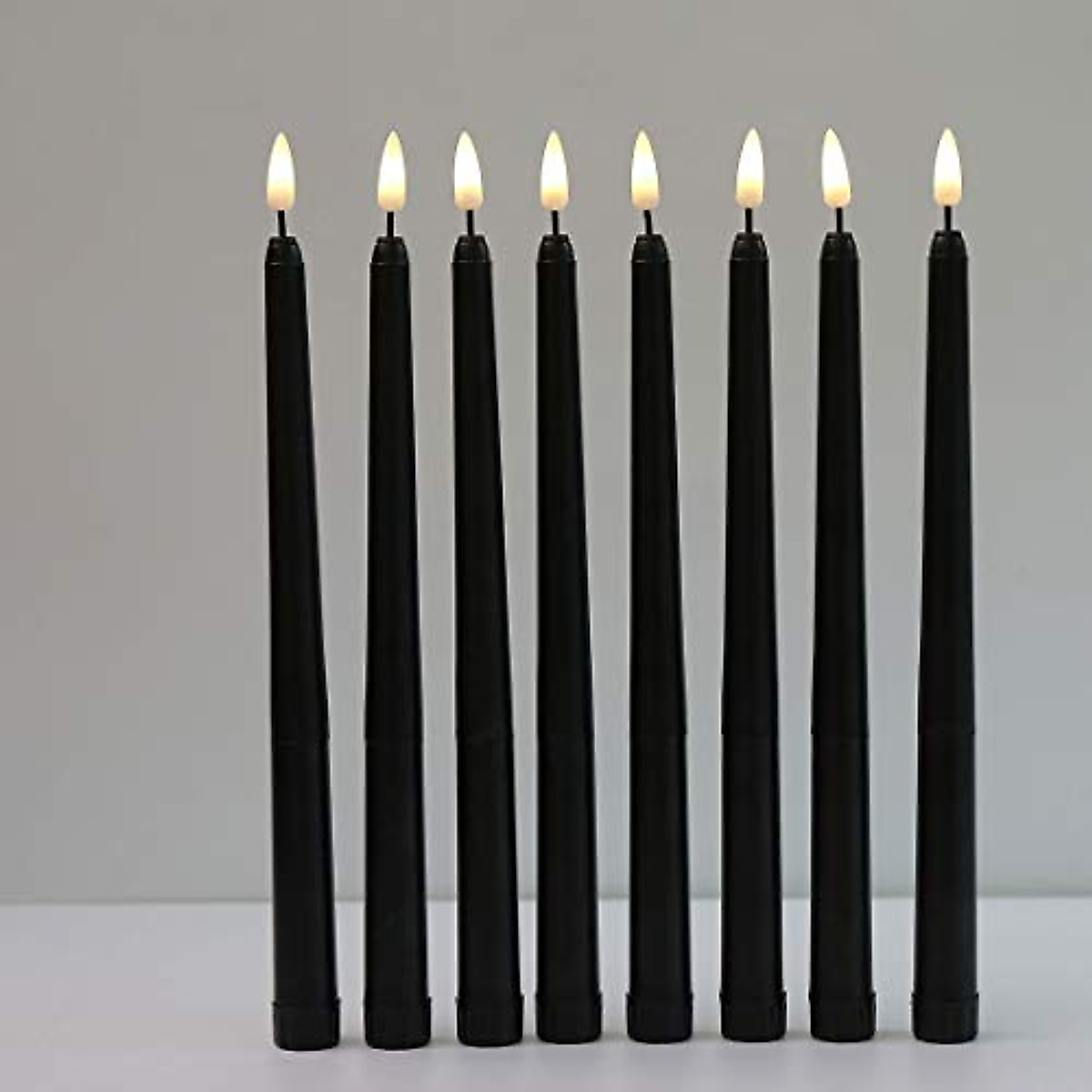 Datomarry Pack of 12 Black Body Flickering Flameless Taper Candles,11 inch Warm White Glow Plastic Battery Powered Realistic Christmas Candles Lights
