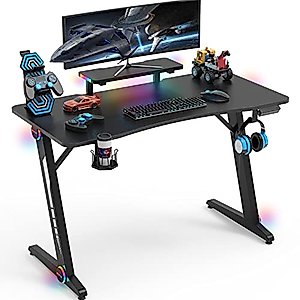 JOY worker RGB Gaming Desk 47 Inch with Led Lights, Music Sync Computer Gamer Desk, Carbon Fiber Surface PC Gaming Desk with Monitor Stand, Ergonomic Z Shaped Gaming Table with Plug Board Holder,Black