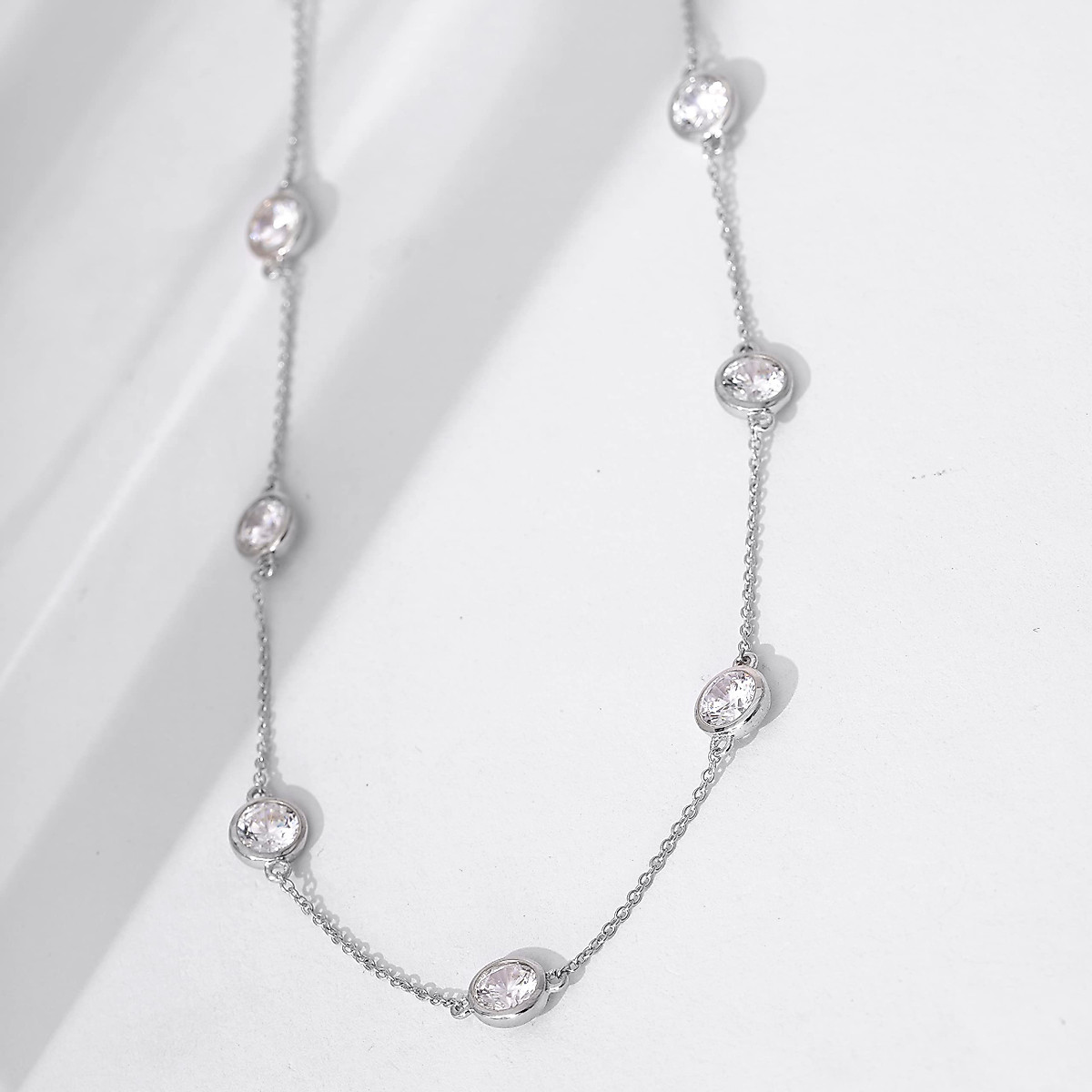 Amazon Essentials Platinum Plated Sterling Silver Station Necklace set with Infinite Elements Cubic Zirconia (4mm), 18" (previously Amazon Collection)