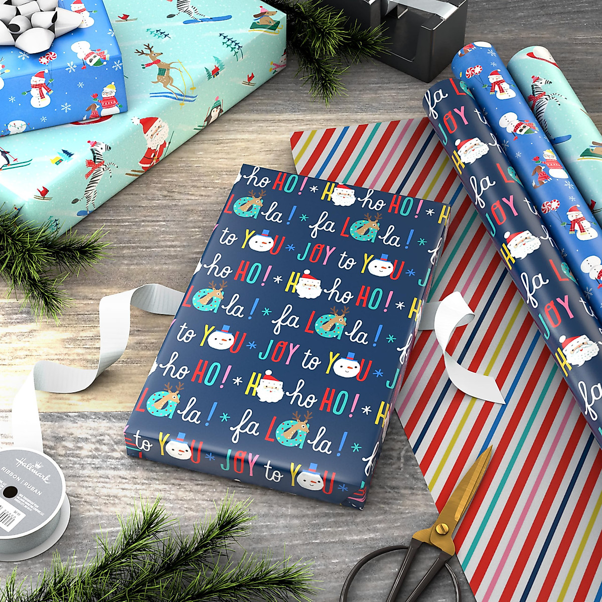 Hallmark Reversible Christmas Wrapping Paper for Kids (3 Rolls: 120 Sq. Ft. Total) Snowmen, Stripes, Trees, Skiing Santa, Zebras, Hedgehogs, Penguins