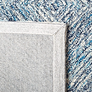 SAFAVIEH Capri Collection Area Rug - 9' x 12', Ivory & Blue, Handmade Wool, Ideal for High Traffic Areas in Living Room, Bedroom (CPR207A)