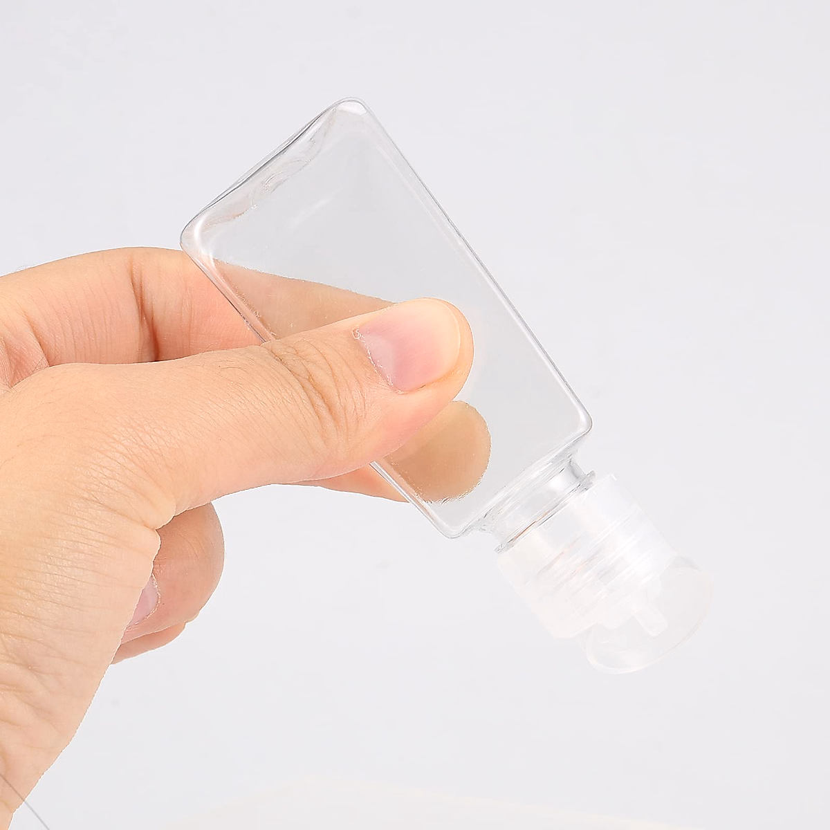 JAPCHET 100 PCS 1 oz Clear Plastic Travel Bottles with Flip Cap, Travel Size Refillable Flip Top Bottles, Small Portable Flip Cap Containers for Liquid, Lotion, Essential Oils, Shampoo and Toiletries