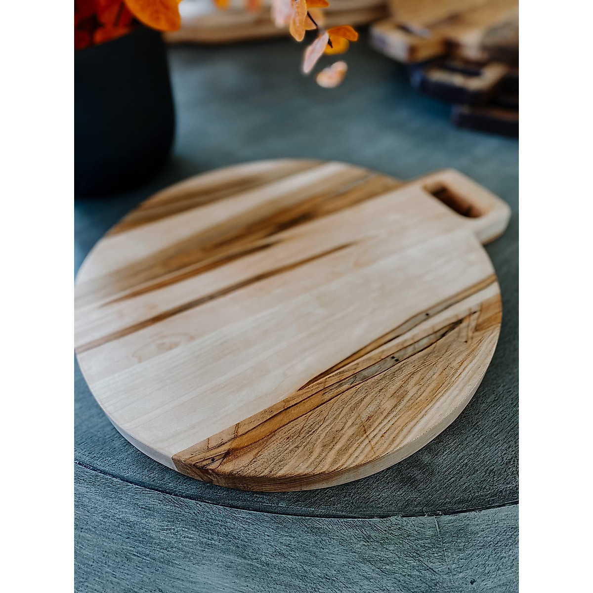 Round charcuterie serving board with handle, handmade in the USA with Maple hardwood.