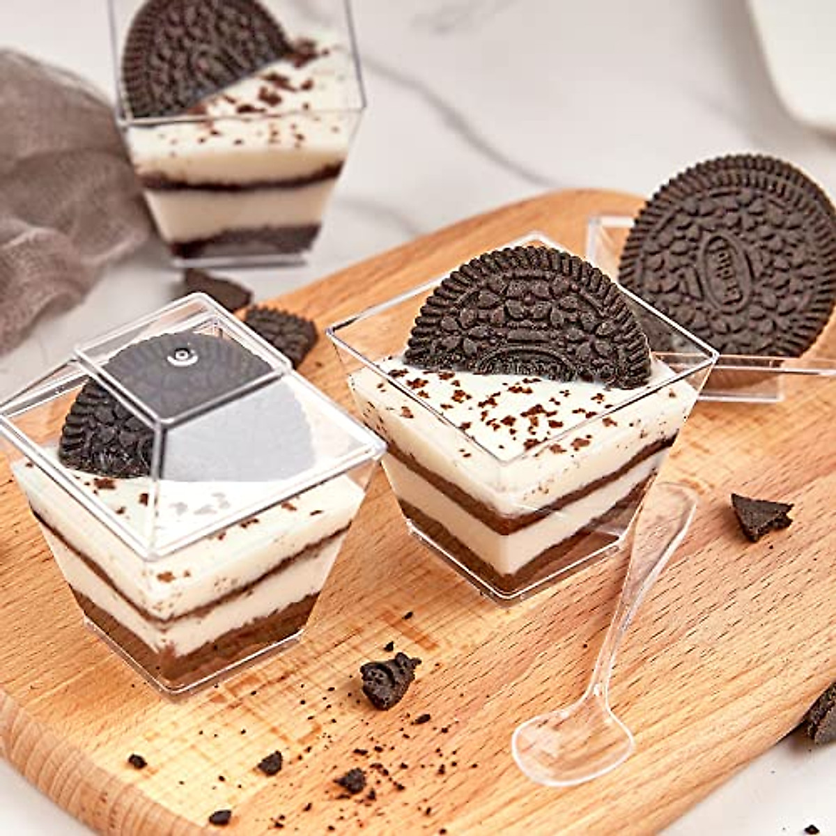 Qeirudu 100 Pack 2 oz Plastic Dessert Cups with Lids and Spoons - Mini Shooter Cups for Desserts Small Square Serving Cups for Party Individual Banana Pudding Appetizers Parfait