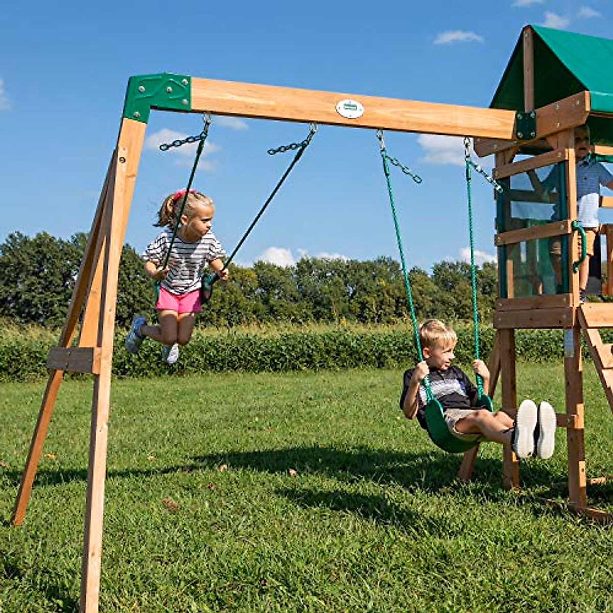 Backyard Discovery Buckley Hill Wooden Swing Set, Made for Small Yards and Younger Children, Two Belt Swings, Covered Mesh Fort with Canopy, Rock Climber Wall, 6 ft Slide Green