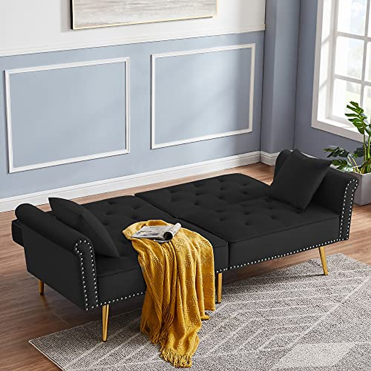Zushule Futon Sofa Bed -Velvet Tufted Convertible Couch with 2 Pillows, Nailhead Trim, and Metal Legs- - Small Sofabed for Bedroom, Living Room, Apartment - Black with Gold Detail