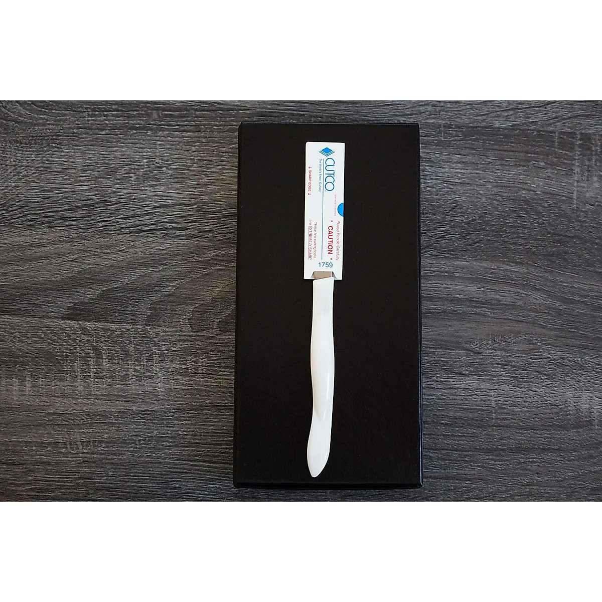 CUTCO Model 1759 Table Knife with White (Pearl) handle....................3.4” High Carbon Stainless DD serrated blade.............in factory sealed plastic bag.
