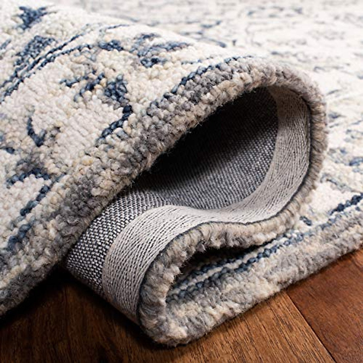 SAFAVIEH Aspen Collection Accent Rug - 4' x 6', Ivory & Blue, Handmade Boho Braided Tassel Wool, Ideal for High Traffic Areas in Entryway, Living Room, Bedroom (APN125A)