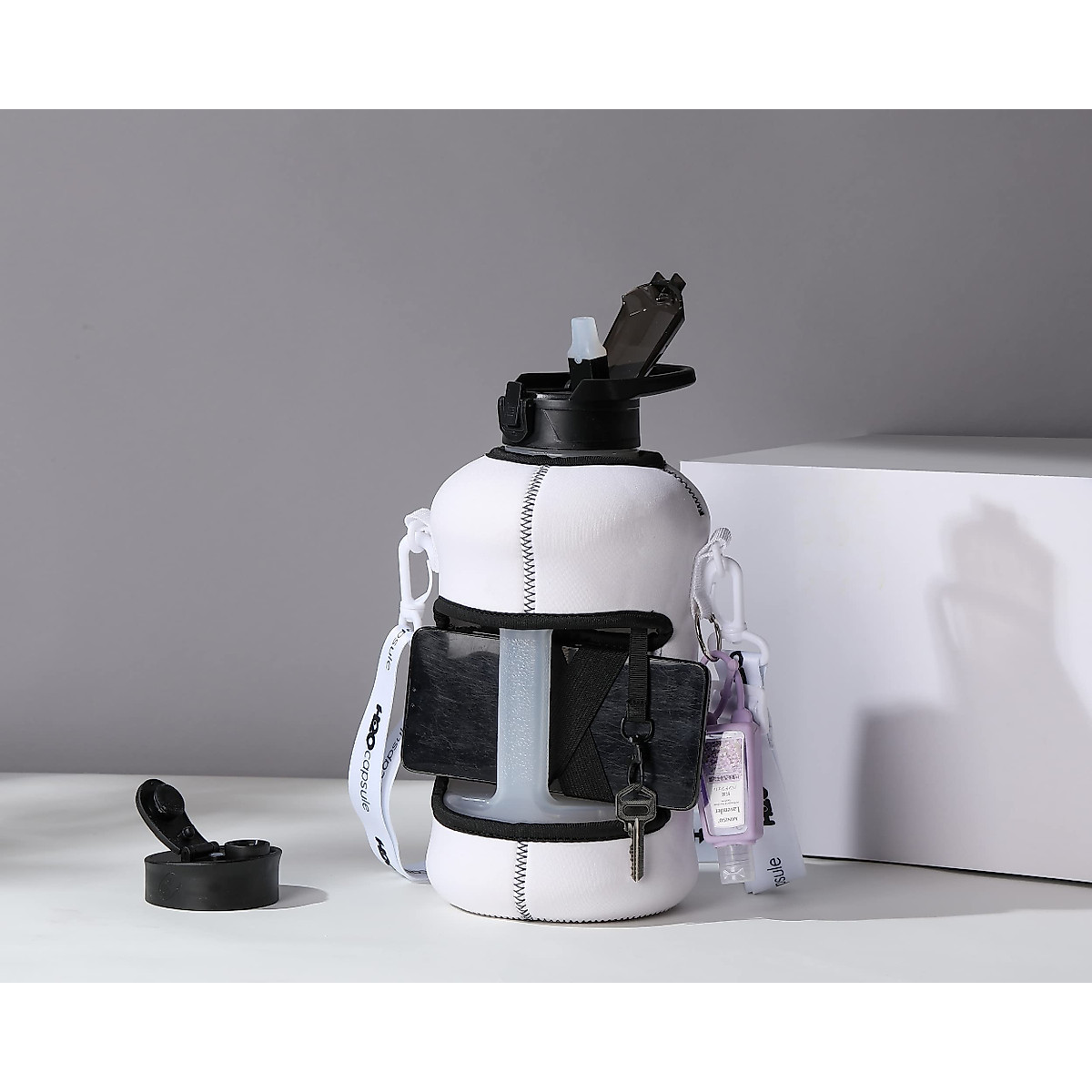 H2O Capsule 2.2L Half Gallon Water Bottle with Storage Sleeve and Covered Straw Lid – BPA Free Large Reusable Drink Container with Handle - Big Sports Jug, 2.2 Liter (74 Ounce) Canvas White