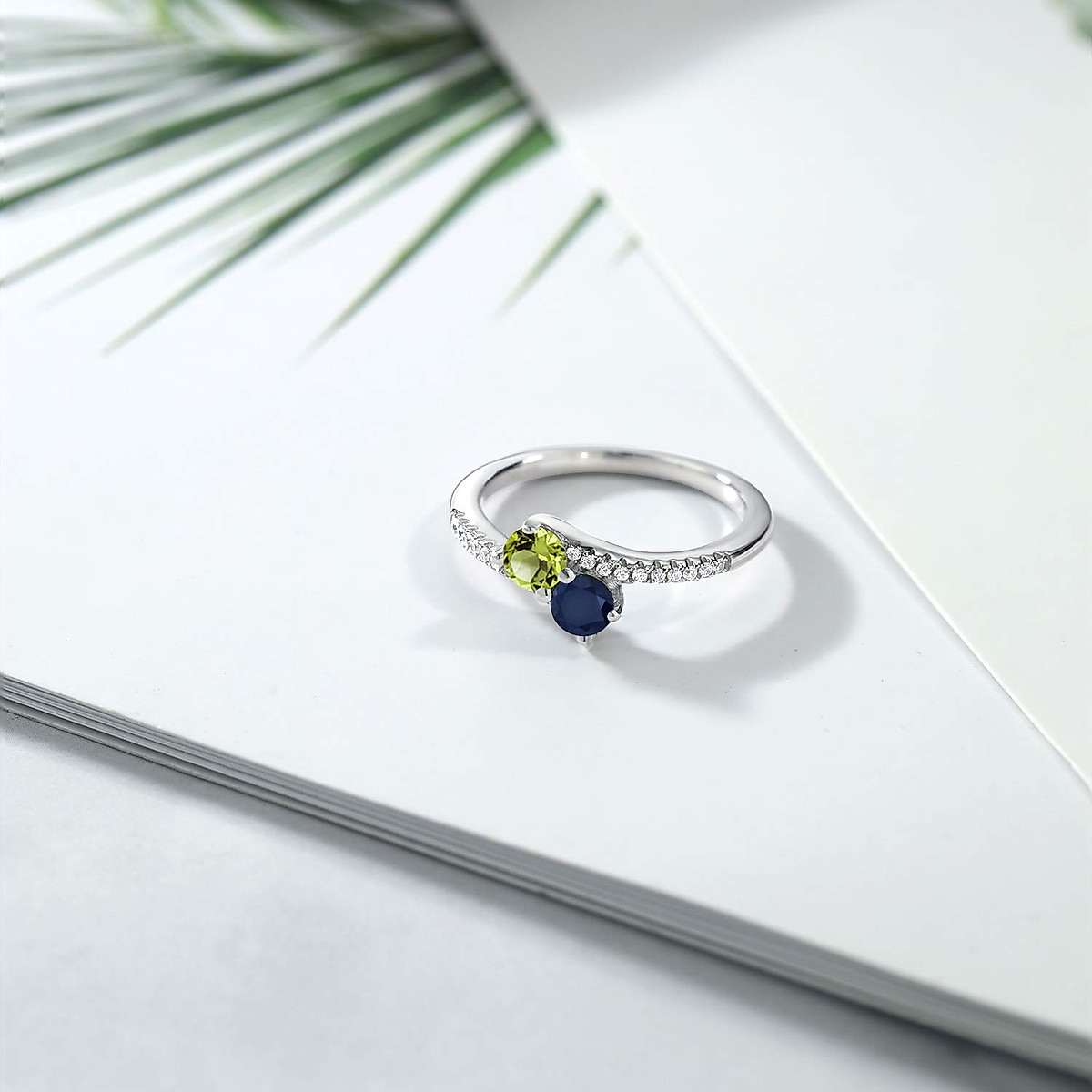 Gem Stone King 925 Sterling Silver Green Peridot and Blue Sapphire Bypass Ring For Women (0.89 Cttw, Gemstone August Birthstone, Round 4MM, Available In Size 5, 6, 7, 8, 9)