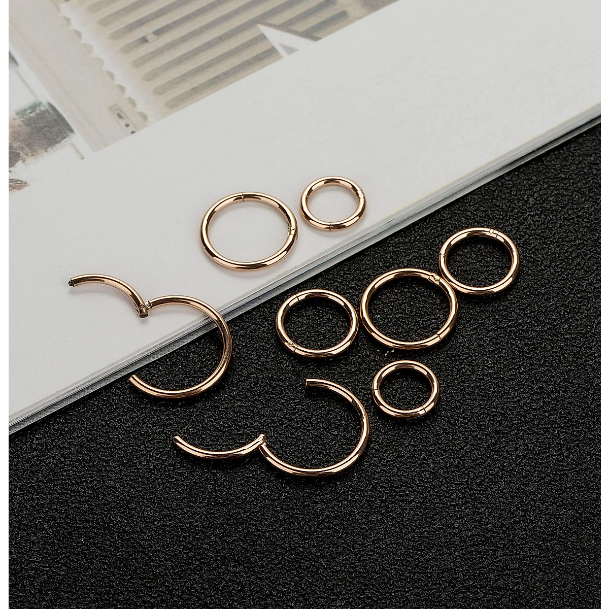 REVOLIA 8Pcs 16G Surgical Steel Nose Rings Hoop Septum Piercings Cartilage Earrings for Women Men Helix Couch Daith Lip Tragus Piercings Hinged Clicker 6-12mm Rose-gold