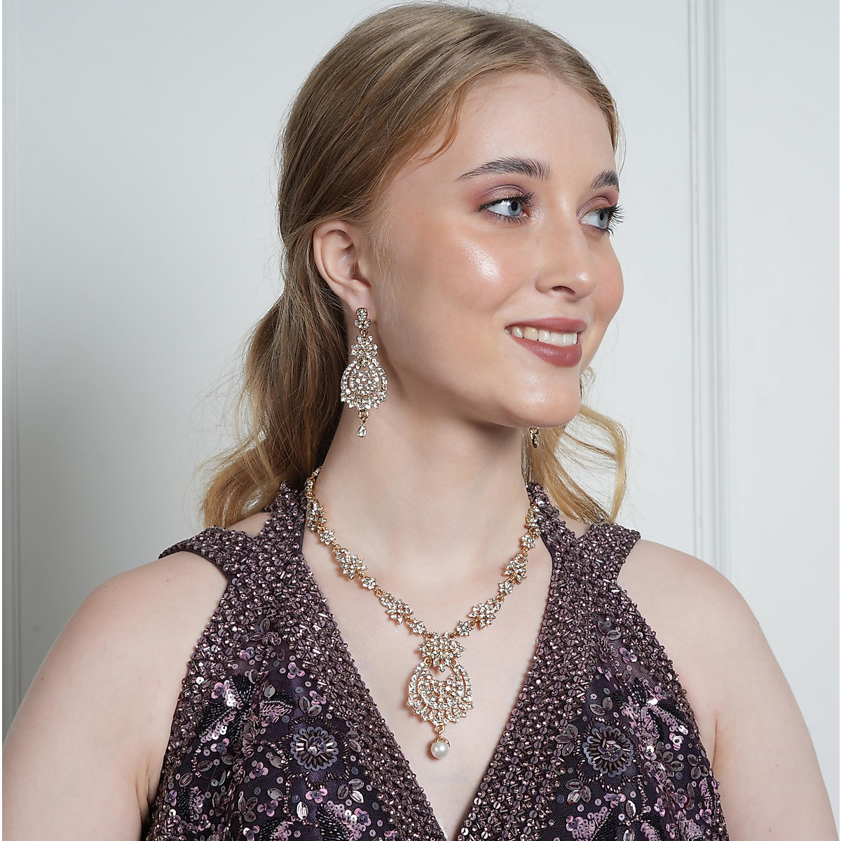 Touchstone Indian Hollywood white rhinestone bridal Designer jewelry necklace set in antique gold tone for women