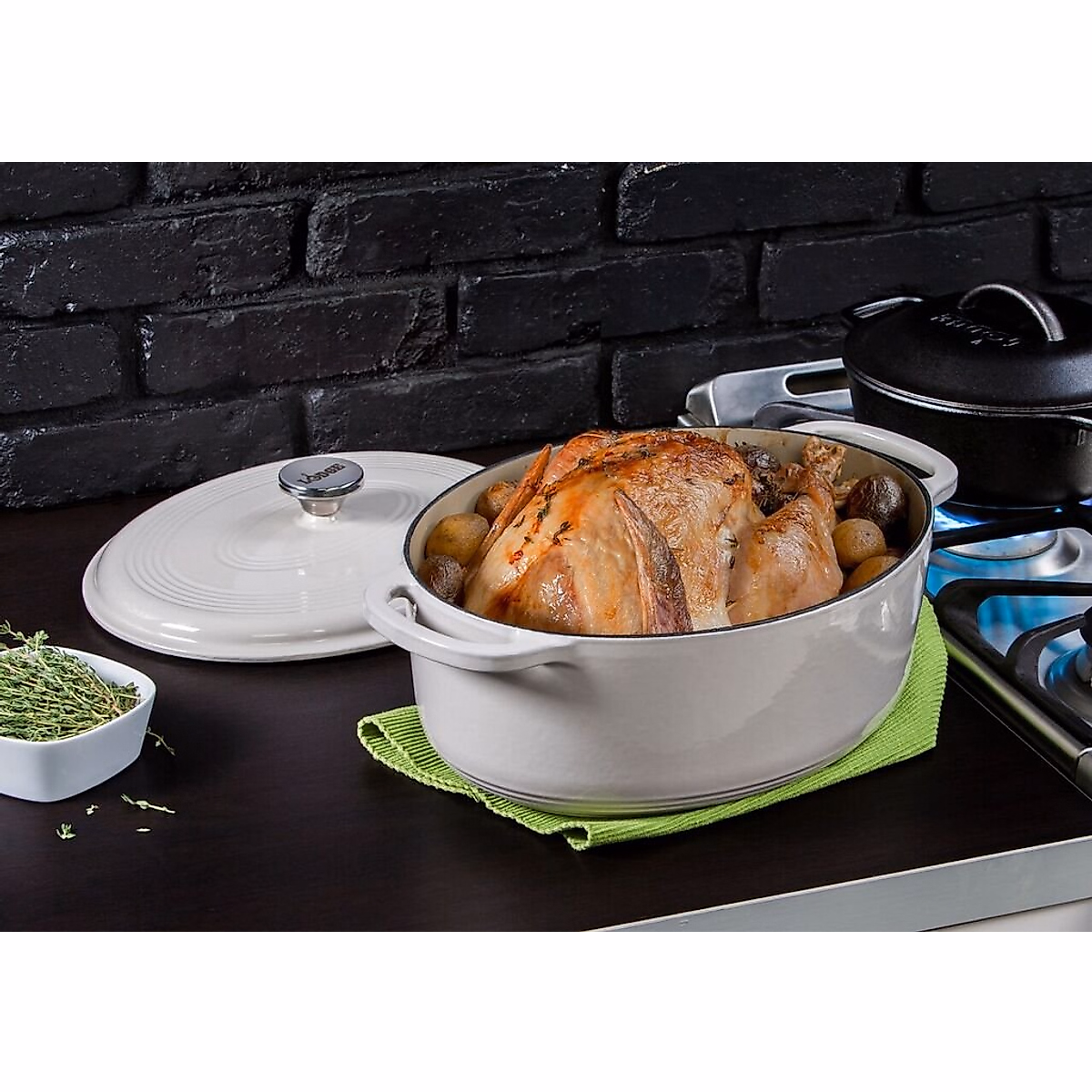 Lodge 7 Quart Enameled Cast Iron Oval Dutch Oven with Lid – Dual Handles – Oven Safe up to 500° F or on Stovetop - Use to Marinate, Cook, Bake, Refrigerate and Serve – Oyster White