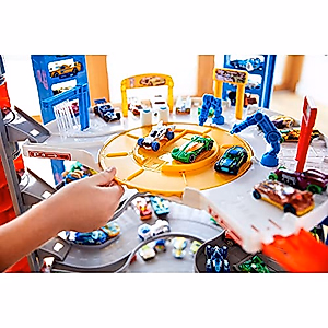 Hot Wheels Toy Car Track Set & 4 1:64 Scale Cars, Super Ultimate Garage, 3+ Ft Tall with Motorized Gorilla & Storage for 140 Cars