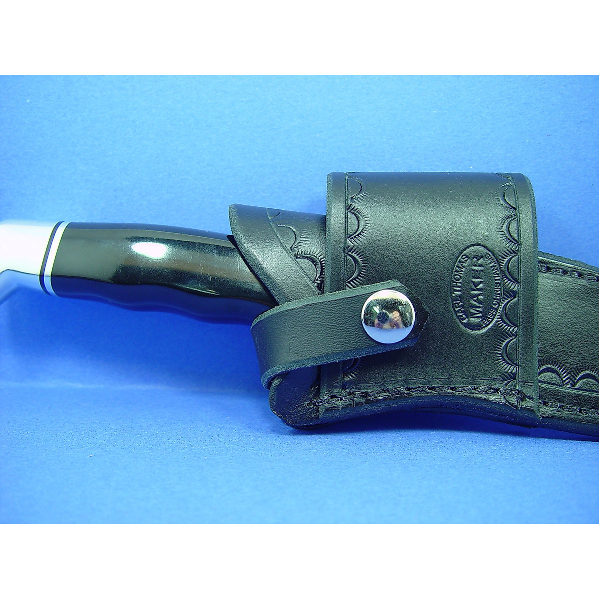 Buck 119 Cross Draw Knife Sheath. This Sheath Is Made Out of 8 Ounce Leather the Leather Is Very Soft Durable and Pliable You Will Not Need to Line Your Sheath for Your Finer Knives. The Leather Is Dyed Black with Border Tooling. The Sheath Can Be Worn on