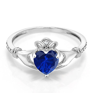 Gem Stone King 10K White Gold Blue Created Sapphire and White Diamond Irish Celtic Claddagh Ring For Women (0.86 Cttw, Heart Shape 6MM, Gemstone Birthstone, Available in size 5, 6, 7, 8, 9)