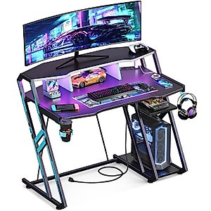MOTPK Gaming Desk with Power Outlet & LED Lights, Gaming Computer Desk 39inch with PC Storage Shelf, Gaming Table with Carbon Fiber Texture, Gamer Desk, Gift for Boys Men, Black