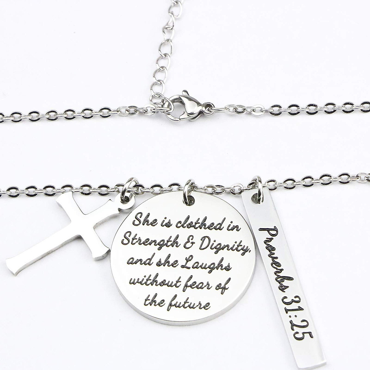 Memgift Christian Necklace Stainless Steel Cross Pendant Jewelry for Women She is Clothed in Strength and Dignity and She Laughs without Fears of the Future