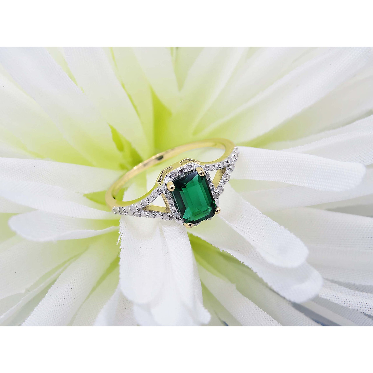 Dazzlingrock Collection 7x5mm Emerald Cut Lab Created Emerald & Round White Diamond Halo Split Shank Engagement Ring for Women in 10K Yellow Gold Size 6