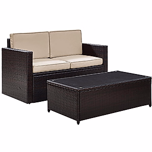 Crosley Furniture Palm Harbor 2-Piece Wicker Outdoor Coffee Table and Loveseat Patio Furniture Set for Porch, Brown with Sand Cushions