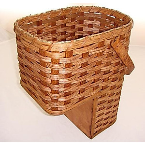 Large 9" stair step basket. Beautifully rests on your stairsteps. Swivel handle, all natural material and made by Old Order Amish. The up splints that are used are on these baskets are oak. Perfect for storing books and magazines. Colors may vary.