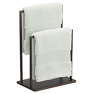 mDesign Modern Decorative Metal Fingertip Towel Holder Stand for Bathroom Vanity Countertops to Display and Store Small Guest Towels or Washcloths - 2-Sided - Bronze