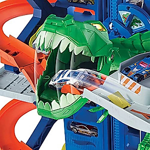Hot Wheels Toy Car Track Set City Ultimate Garage Moving T-Rex Dinosaur, 100+ 1:64 Scale Vehicle Storage, 3-Ft Tall, 2 Toy Cars