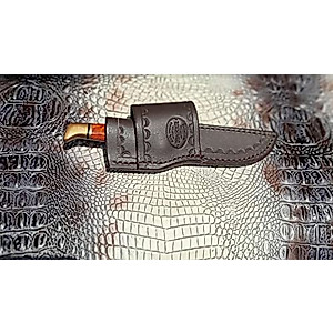 Custom Cross Draw Knife Sheath for Buck 102 Knife. The Sheath Is Made Out of 10 Ounce Water Buffalo Hide Leather the Leather Is Soft Pliable and Very Durable. This Sheath Can Be Worn on the Right or Left Hand Side. It Is Died Dark Brown with Border Toolin