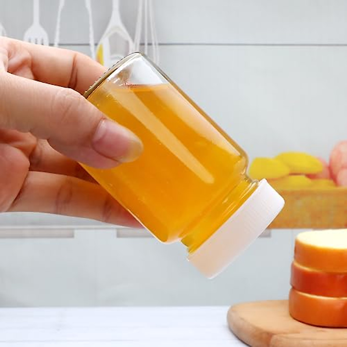 Woaiwo-q 24 Pack 2 oz Glass Shot Bottles w/White Lids - Small Clear Jar for Ginger Shot, Juice, Sample, Whiskey - Travel Essentials Mini Bottles - Wide Mouth, Leakproof…