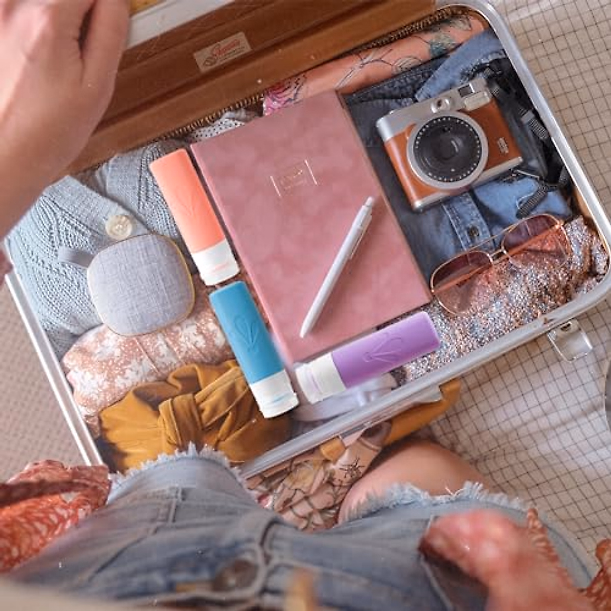 Wonsea 4 pack Travel Bottles for Toiletries TSA Approved Leak Proof containers BPA Free Travel conditioner Silicone Travel size bottles shampoo container 3oz Travel bottle with bag (Purple and Pink)