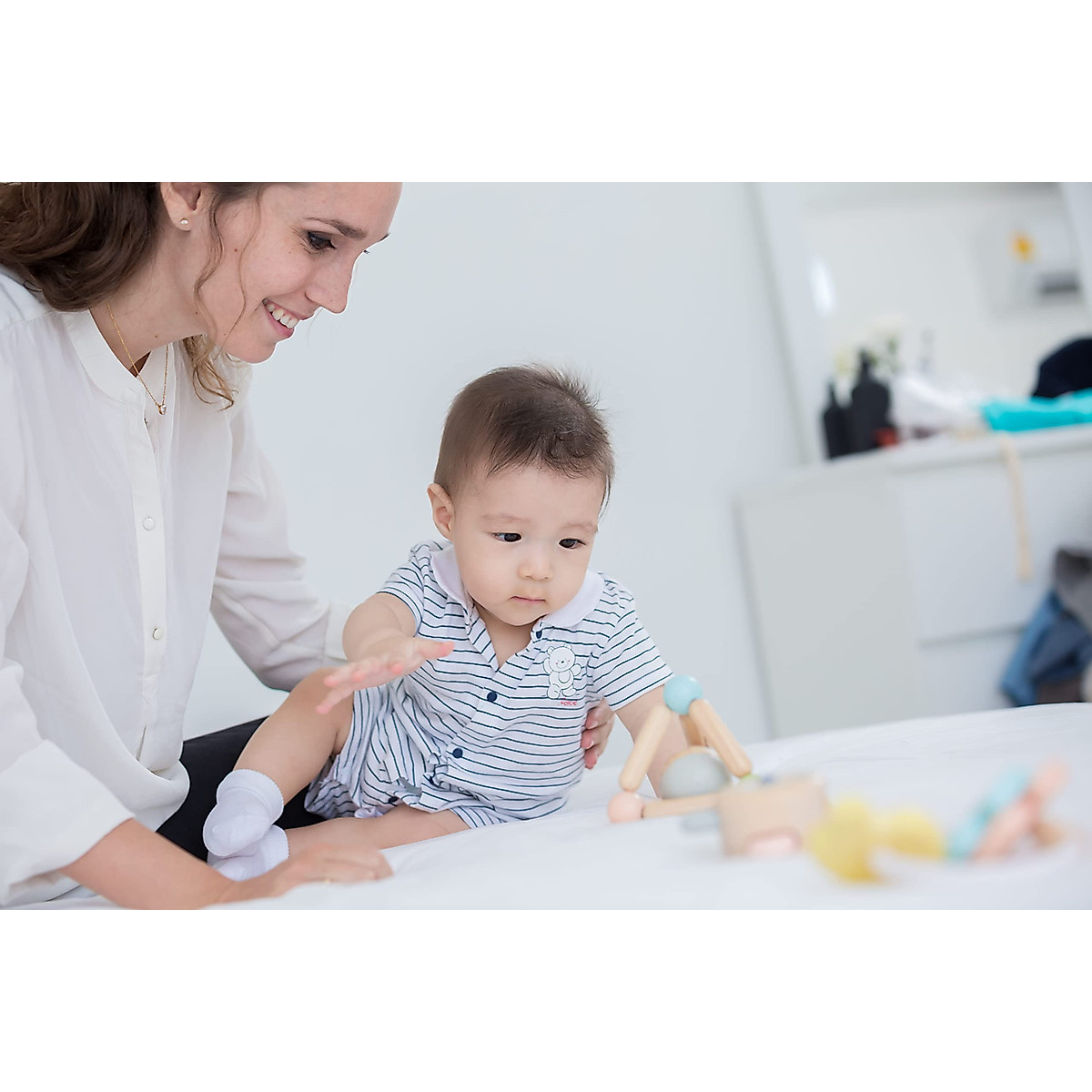 PlanToys Wooden Clutching Triangle Baby Toy with Gentle Sound in Two-Toned Ball (5256) | Pastel Color Collection |Sustainably Made from Rubberwood and Non-Toxic Paints and Dyes