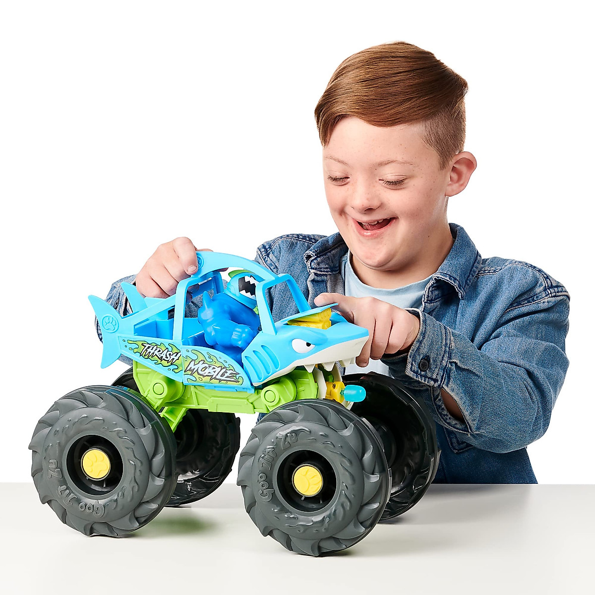 Heroes of Goo Jit Zu "Stretch and Strike Thrash Mobile! Vehicle with Missile Launcher and Stretchy, Goo Filled Exclusive Race Suit Thrash.