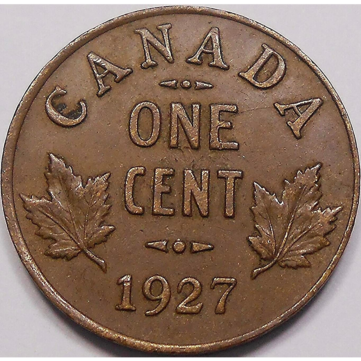 1920-1936 1 Cent Canadian Coin. Issued Under King George V, A British and Canada Royal. 1 Cent Graded By Seller. Circulated Condition.