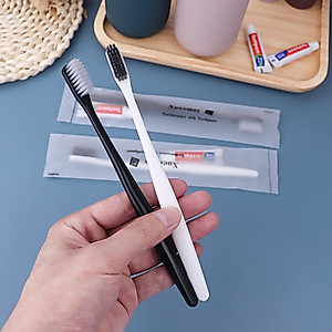 Xuezoioy Disposable Toothbrushes with Toothpaste Pack of 50,Individually Wrapped Disposable Travel Toothbrush Kit in Bulk for Homeless,Nursing Home,Shelter,Hotel,Charity(Black+White)