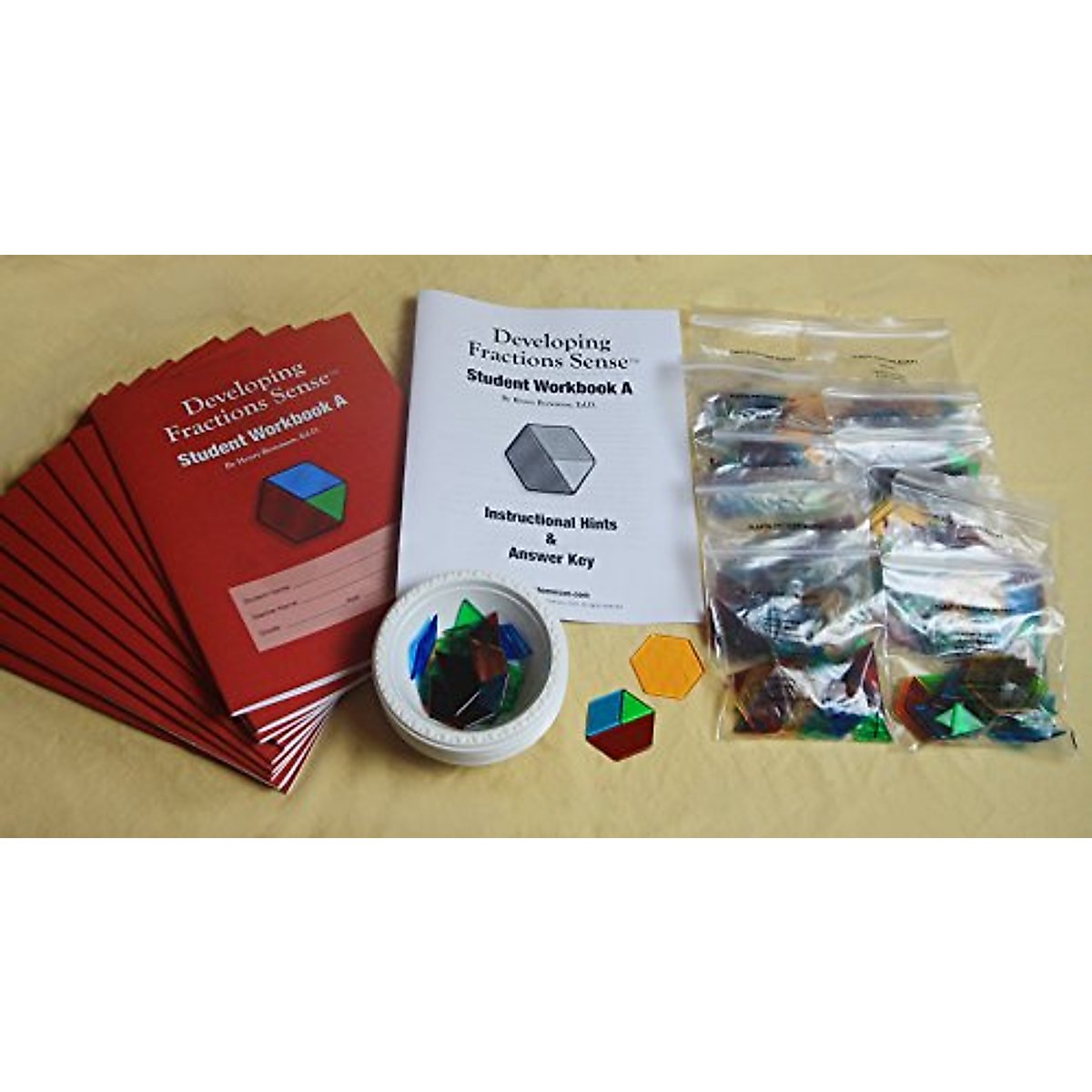 Developing Fractions Sense® A Class Set of 10 - Grade 3. A Concrete and Visual Introduction to Fractions. Includes 10 Student workbooks, 10 Sets of Fraction manipulatives, Teacher Set and Answer Key.