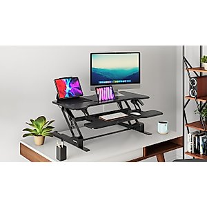 Mount-It! Height Adjustable Standing Desk Converter, 38” Wide, Stand Up Desk Riser for 2 Monitors, Manual Gas Spring Desktop Raises to 16.9", Fits Two Monitor Screens with Keyboard Mouse Tray in Black