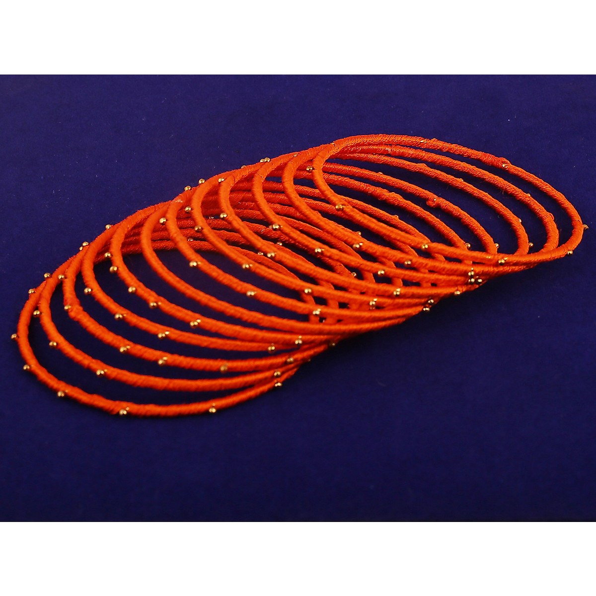 Touchstone New Silk Thread Bangle Collection Indian Bollywood Handcrafted Faux Silk Thread Exotic Look Golden Beads Carrot Orange Designer Bangle Bracelets Set of 12 for Women.