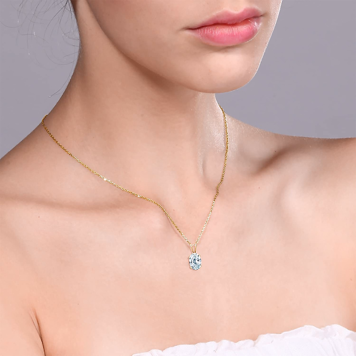 Gem Stone King 14K Yellow Gold Sky Blue Aquamarine Pendant (0.72 Cttw, Gemstone Birthstone, Oval 7X5MM, With 18 Inch Chain)