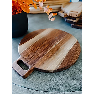 Round charcuterie serving board with handle, handmade in the USA with Walnut hardwood.