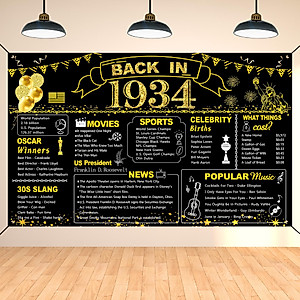 DARUNAXY 90th Birthday Black Gold Party Decoration, Back in 1934 Banner 90 Year Old Birthday Party Poster Supplies, 6x3.6ft Large Fabric Vintage 1934 Backdrop Photography Background for Men and Women