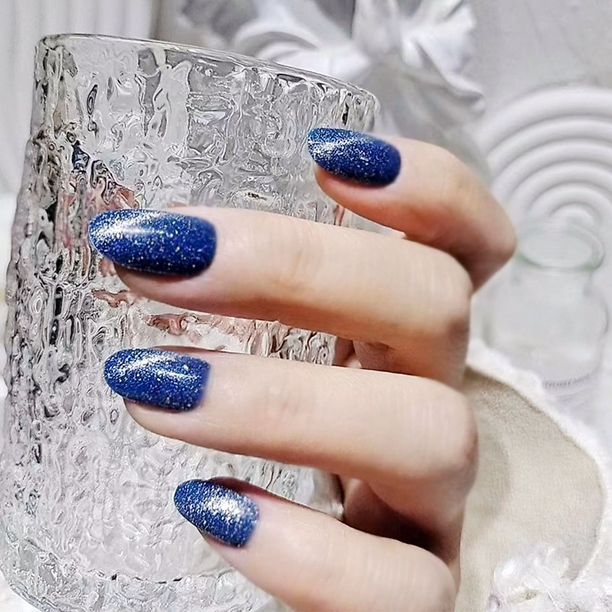 Short Press on Nails Medium Almond Cat Eye Fake Nails False Nails with Glitter Sparkly Designs Blue Full Cover Acrylic Nails Light Luxury and Glossy Artificial Nails for Women 24Pcs