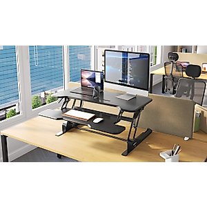 Mount-It! Height Adjustable Standing Desk Converter, 38” Wide, Stand Up Desk Riser for 2 Monitors, Manual Gas Spring Desktop Raises to 16.9", Fits Two Monitor Screens with Keyboard Mouse Tray in Black