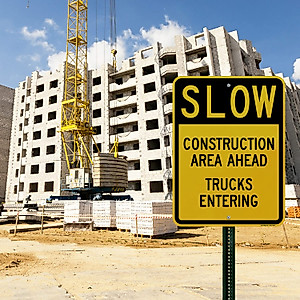 SmartSign 24 x 18 inch “Slow - Construction Area Ahead, Trucks Entering” Metal Sign, 80 mil Laminated Rustproof Aluminum, Black and Yellow, Made in USA