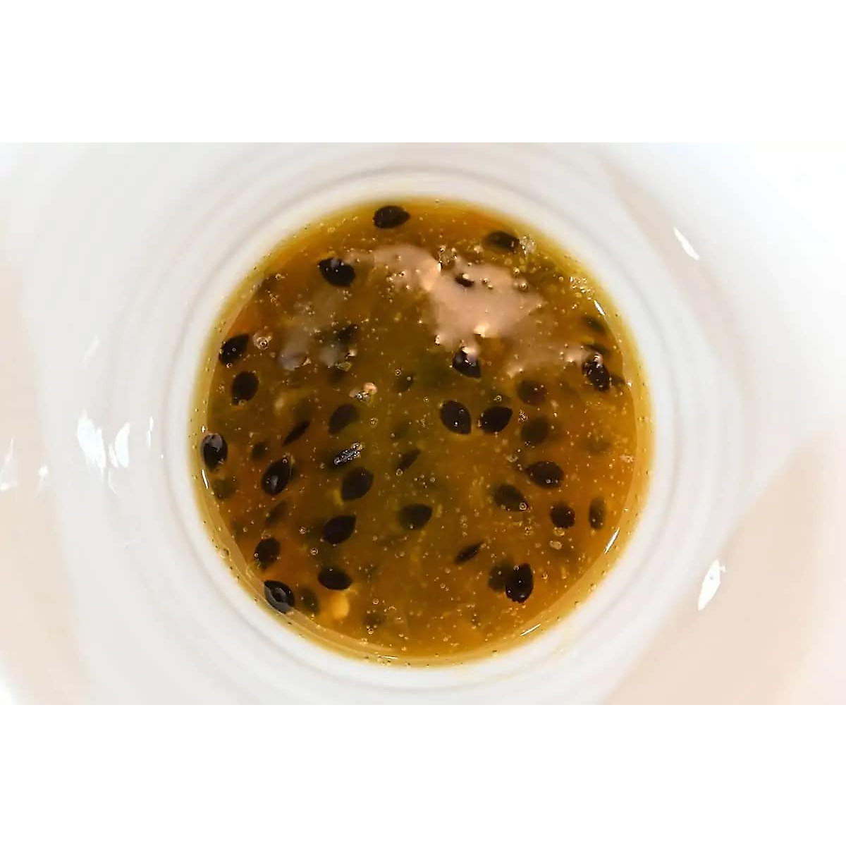 Al Amin Foods Vonbee Passion Fruit Honey Puree. One Bottles 42.32oz/ 2.6lb. Quite good and very versatile.