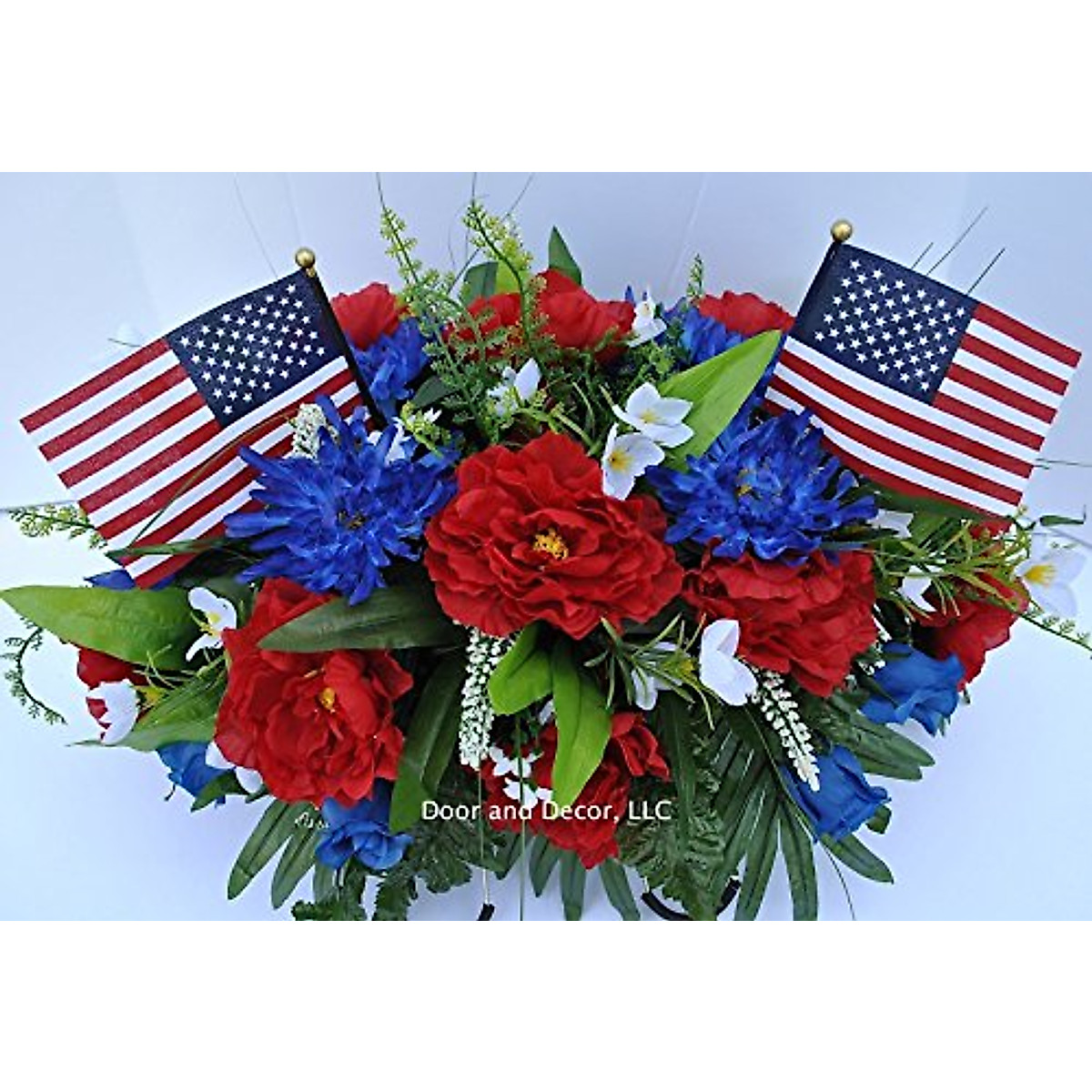 Summer Patriotic Cemetery Flowers with Red Roses, Blue Spider Mums, Blue Roses, and White Forget-me-nots headstone saddle arrangement