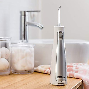 Waterpik Water Flosser Cordless Dental Oral Irrigator for Teeth with Portable Travel Bag and 3 Jet Tips, Cordless Freedom ADA Accepted, WF-03, White