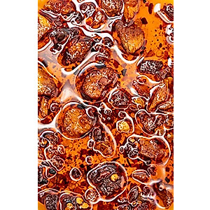 Hot Crispy Oil, An all natural unique blend of fresh fried shallots, fresh garlic and a proprietary blend of three different chili peppers. Highly addictive.