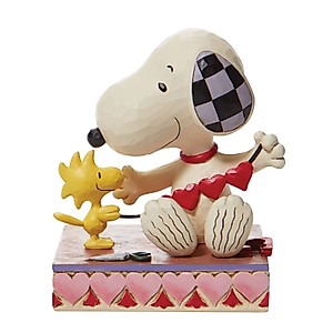 Enesco Peanuts by Jim Shore Woodstock and Snoopy with Heart Garland Figurine- Resin Hand Painted Collectible Decorative Figurines Home Decor Sculpture Shelf Statue Room Desk Collection Gift, 4.5 Inch