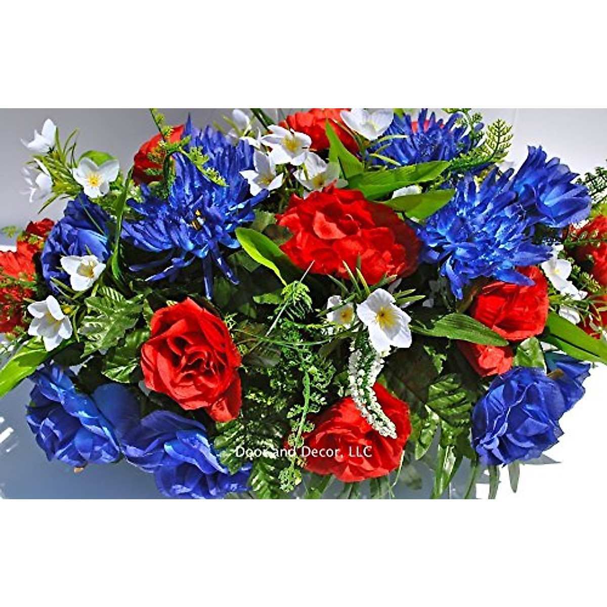 Summer Patriotic Cemetery Flowers with Red Roses, Blue Spider Mums, Blue Roses, and White Forget-me-nots headstone saddle arrangement